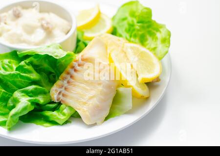 Steamed haddock fillet served with an exquisite salad consisting of ...