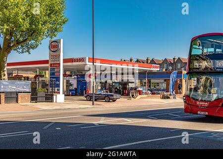 Logo on forecourt roof of Esso fuel station close-up against partial clouds in Faringdon, also ...