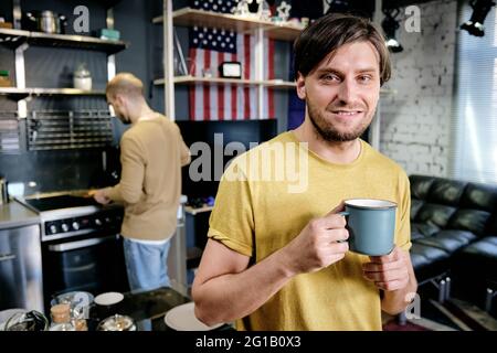 Two females only cooking and having fun in a kitchen together. Young ...