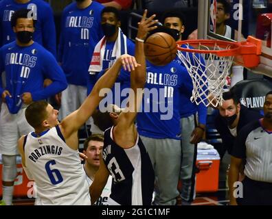 Dallas Mavericks' Kristaps Porzingis blocks the shot of Minnesota ...