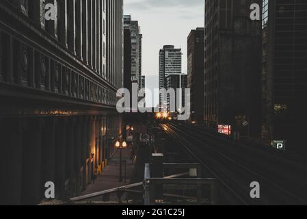 Train subway at night, Chicago, Vintage cityscape of Chicago skyline ...