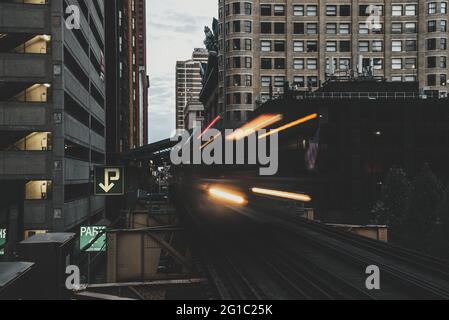 Train subway at night, Chicago, Vintage cityscape of Chicago skyline ...