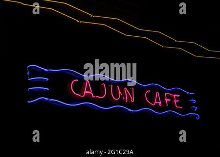 Vintage Neon Cajun Cafe Sign on Restaurant Wall Stock Photo - Alamy