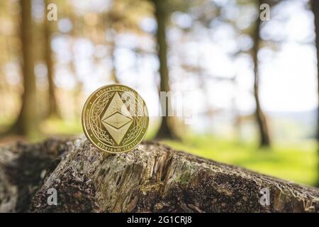ETH Ethereum coin close up on business graph background Stock Photo - Alamy