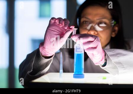 Middle aged technician in laboratory with lab coat, Freiburg, Baden ...