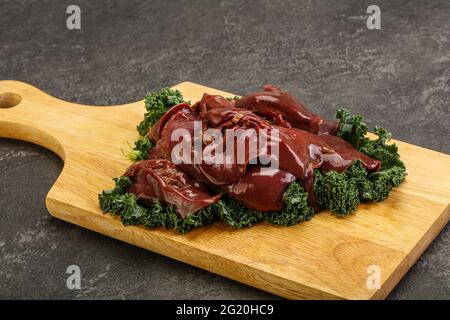 Raw chicken liver over board for cooking Stock Photo - Alamy