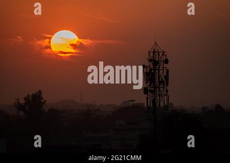 Silhouette of communications tower against sunset sky Stock Photo - Alamy