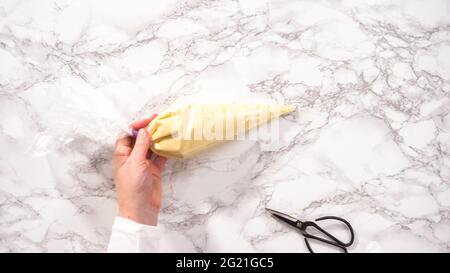 Step by step. Transferring pancake batter into a piping bag to prepare ...