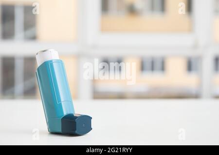 Modern inhaler on table near window, closeup Stock Photo - Alamy