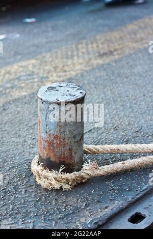 Cleat for mooring. Fastening for mooring ropes on a boat. Season of the ...