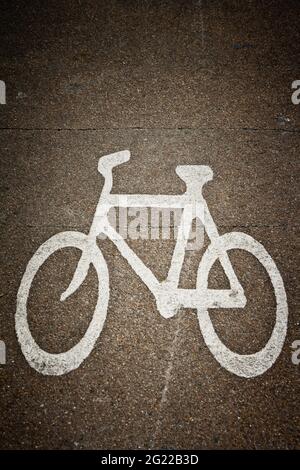 Bycicle sign painted on the road Stock Photo - Alamy