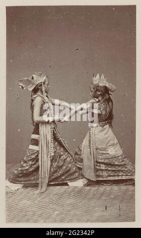 Studio Portrait of two Javanese dancers in traditional clothing and ...