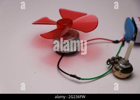 DC Motor with propeller attached to shaft connected to breadboard ...