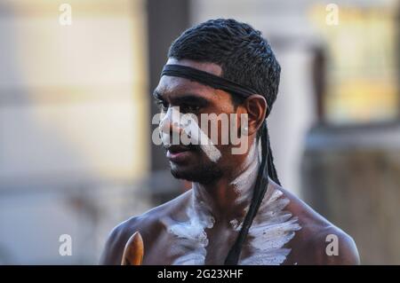 Australian Aboriginal performing a street performance with traditional ...