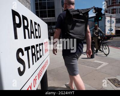 People passing Praed Street, street sign Paddington London Stock Photo ...