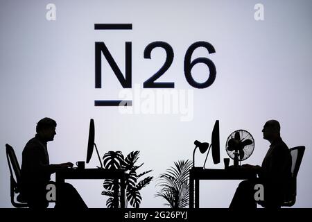 The logo of N26 is seen on a screen of a smartphone next to an ...