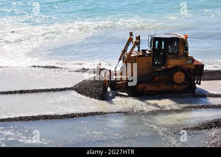 Work on the seaside with a loader in Nice Stock Photo - Alamy