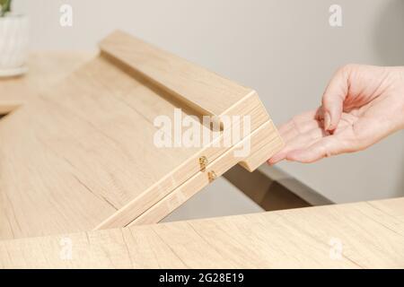 Extendable dinning table. Slide gear close up view Stock Photo - Alamy