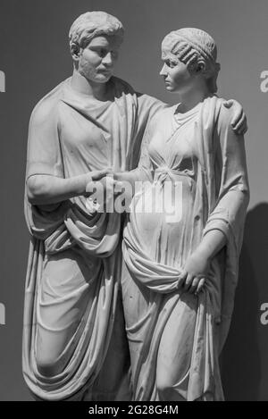 A pair of Roman stone statues hold up the grotto of the Garden Mound at ...