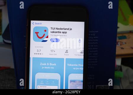 A close up of the TUI logo on the tail fin of a passenger aircraft ...