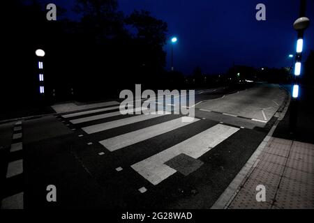 Zebra Crossing at night with Belisha Beacons at each end. No people ...