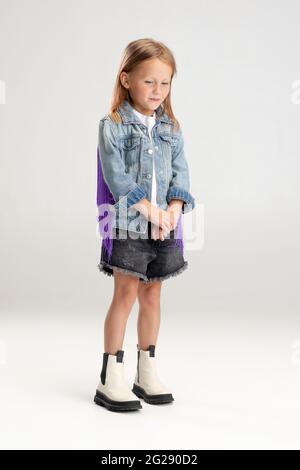 Shy little girl posing - isolated over a white background Stock Photo ...