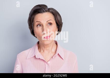 Photo of doubtful unsure lady wear striped t-shirt looking empty space ...