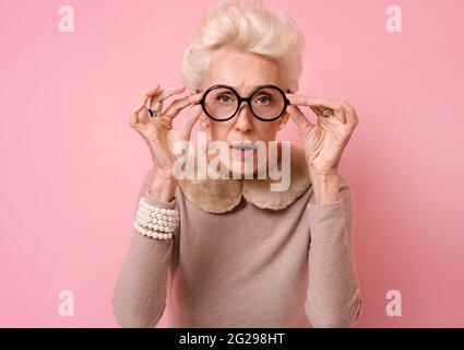 Photo of attractive astonished lady hold red card netbook impressed low ...