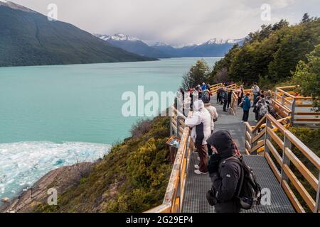PERITO MORENO, ARGENTINA - MARCH 10, 2015: Tourists on boardwalks ...