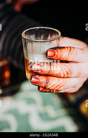 A hand giving a cup of fresh hot cappuccino Stock Photo - Alamy