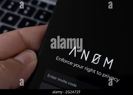 ANOM app logo seen on the smartphone and laptop on blurred background ...