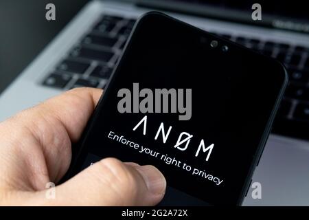 ANOM app logo seen on the smartphone and laptop on blurred background ...