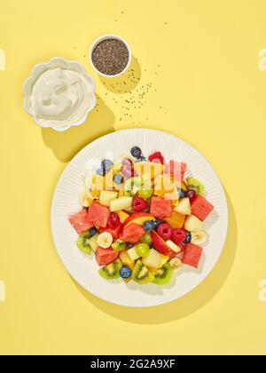A top view of a plate of fruit salad on the table Stock Photo - Alamy