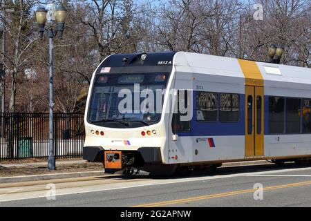 A NJ Transit River Line diesel light rail train makes a turn onto ...