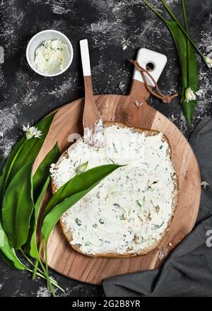 A delicious grilled whole soft cheese wheel, like camembert or brie ...