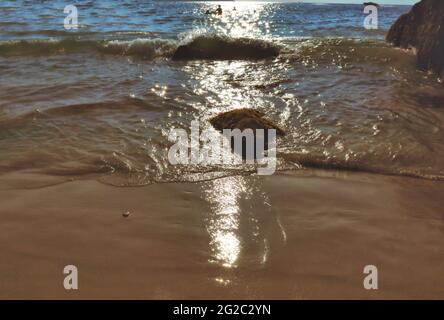Heat at sea, waves glisten in the sun, beach vacation Stock Photo - Alamy