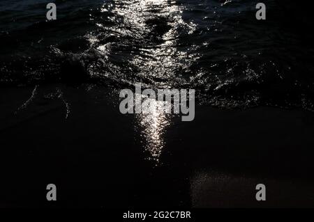 Heat at sea, waves glisten in the sun, beach vacation Stock Photo - Alamy