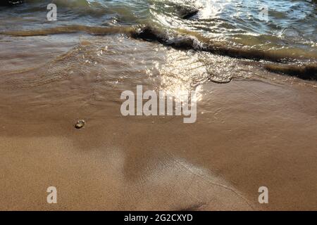 Heat at sea, waves glisten in the sun, beach vacation Stock Photo - Alamy