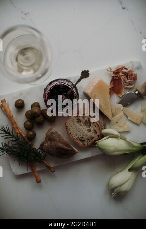 variation of cheese ,wine and bread on a stone table Stock Photo - Alamy