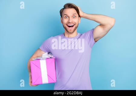 Photo of cheerful astonished guy arm on head open mouth unbelievable ...