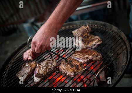 Lamb roast, detail of a lamb on the grill to cook, party and ...