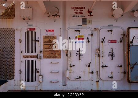 IMO safety and security signs on side of cargo ship which needs ...