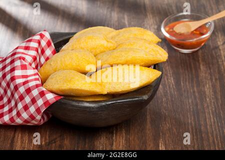 Tasty empanadas - Colombian cuisine; photo on wooden background Stock ...