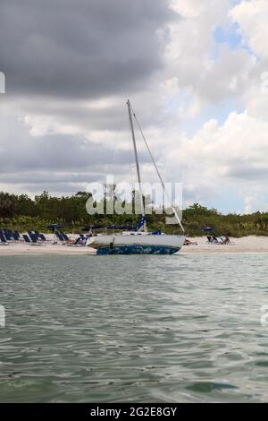 Shipwrecked sailboat on the beach of Clam Pass in Naples, Florida seen ...