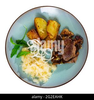 Rabbit liver dish with boiled potatoes and sauerkraut closeup Stock ...
