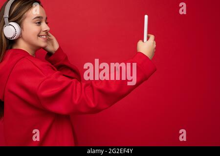 Profile photo of pretty positive girl toothy smile flying hair isolated ...