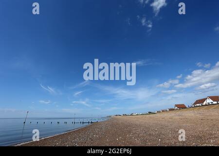 Heacham, UK. 08th June, 2021. A paddleboarder silhouetted against the ...