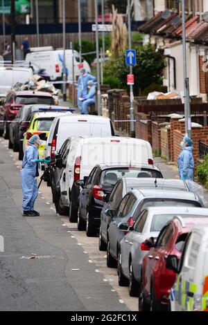 Police forensic officers on Blyth Road in Hayes, west London, where a ...