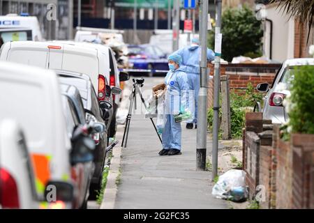 Police forensic officers on Blyth Road in Hayes, west London, where a ...