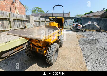 Mini yellow dumper with roll bar and orange flashing lights tipper ...